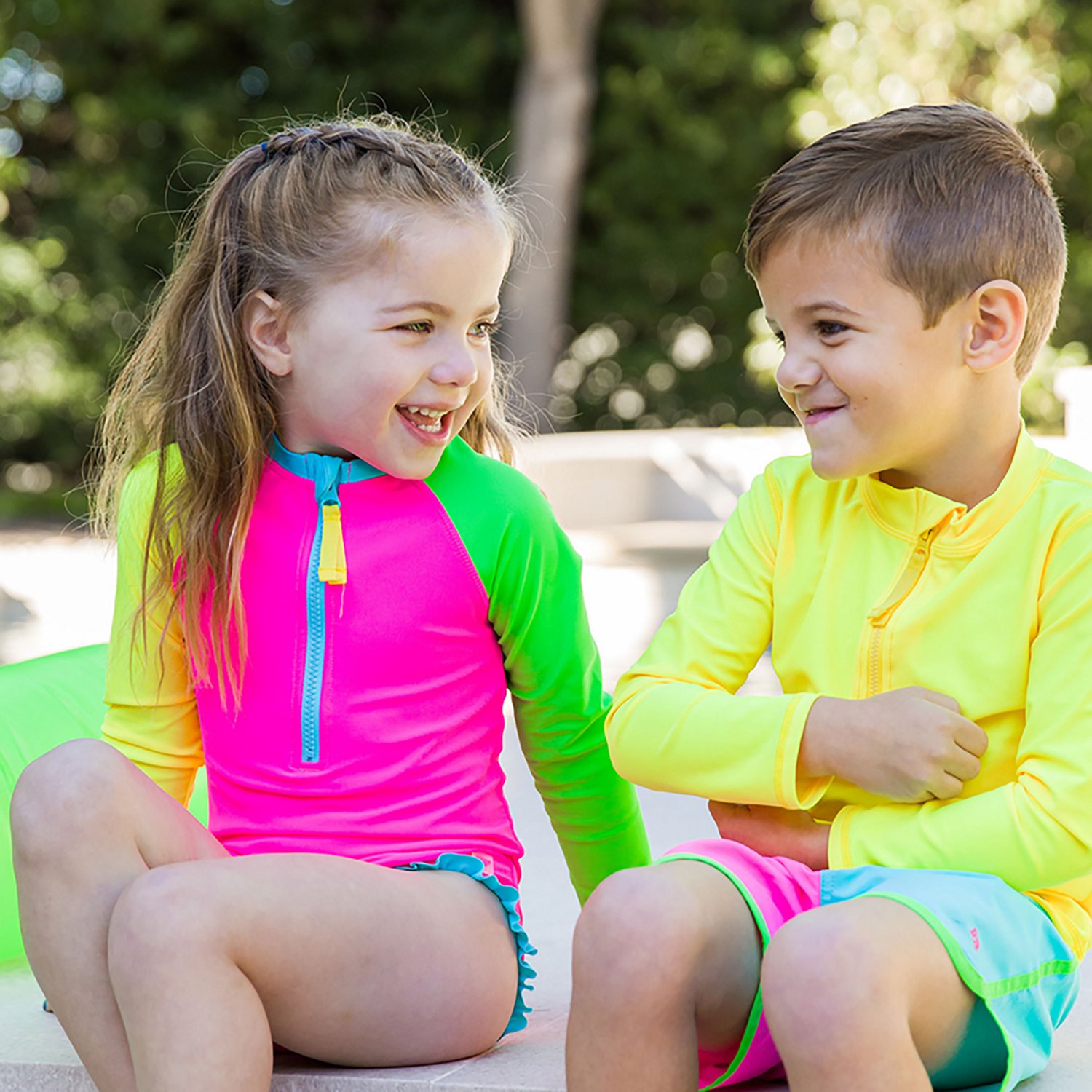 RuffleButts Girls' 4-7 Neon Color Block Long Sleeve Rash Guard | Academy